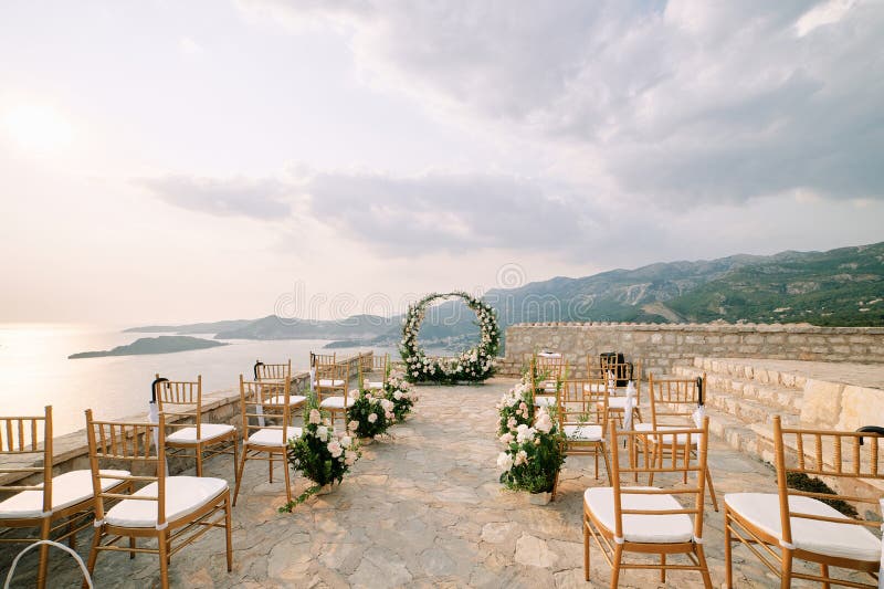 Chairs Stand in Rows in Front of a Round Wedding Arch on an Observation ...