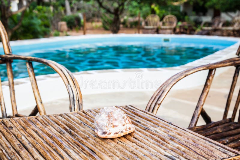 Chairs on Swimming Pool Border Stock Photo - Image of blue, vacation ...