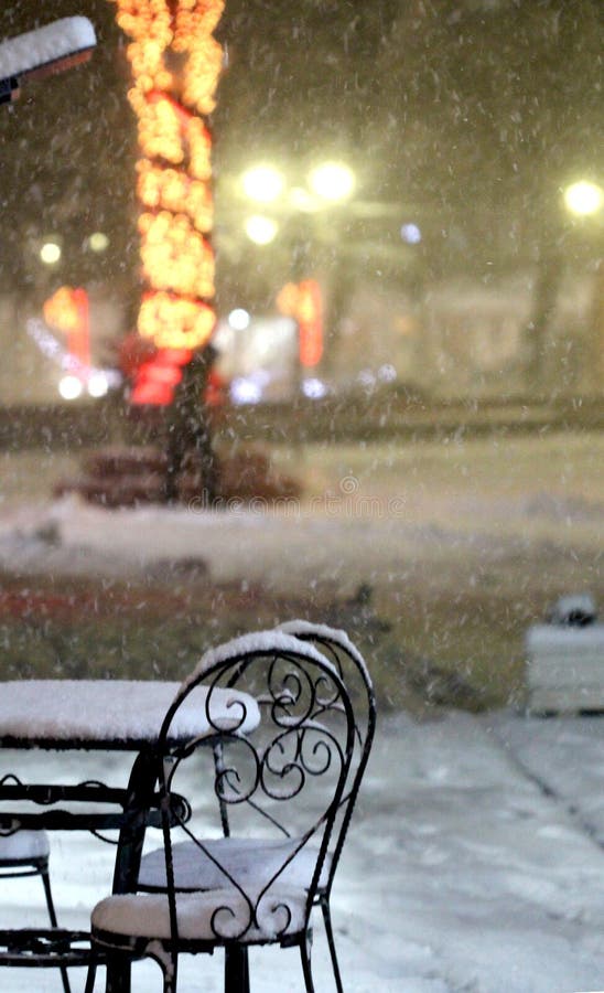 Chairs and Table in Outdoors Caffe on Snowy Cold Night Stock Image ...