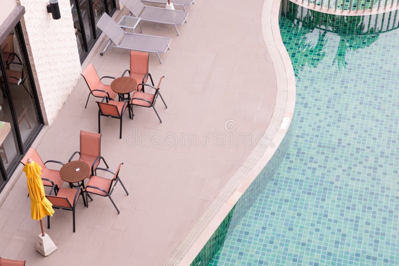 Chairs and Table with a Part of Swimming Pool Stock Photo - Image of ...