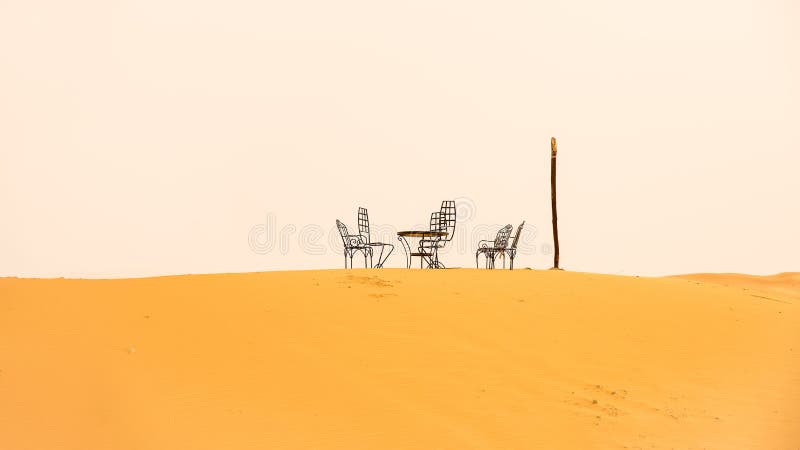 Chairs and Table in the Sand of the Desert Stock Photo - Image of style ...