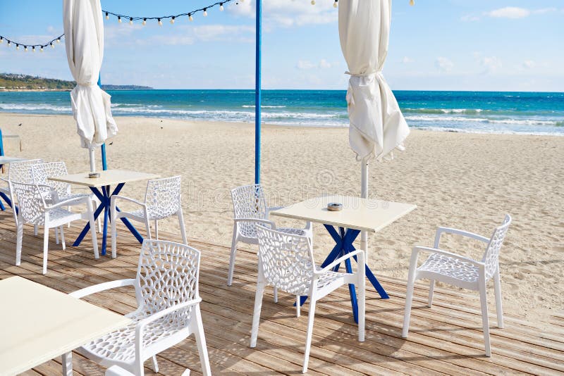 Chairs and Tables of Beach Cafe Stock Image - Image of people, shore ...