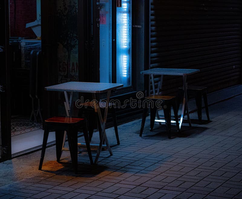 Chairs and Tables Outside of a Cafe at Night Stock Photo - Image of ...