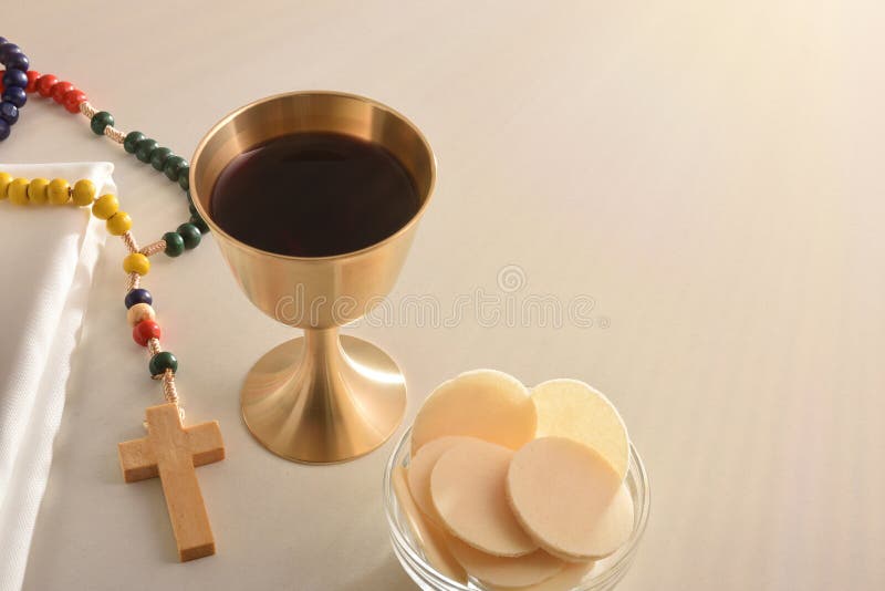 Chalice and Consecrated Host on Table with Cross Elevated View Stock ...