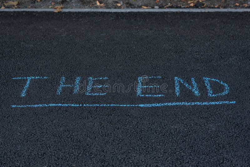Chalk Inscription on Asphalt the END. Text on the Road Stock Photo ...