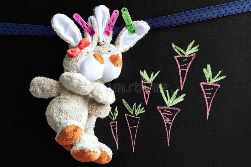 Chalkboard with Carrots and Toy Rabbits Stock Image - Image of ...