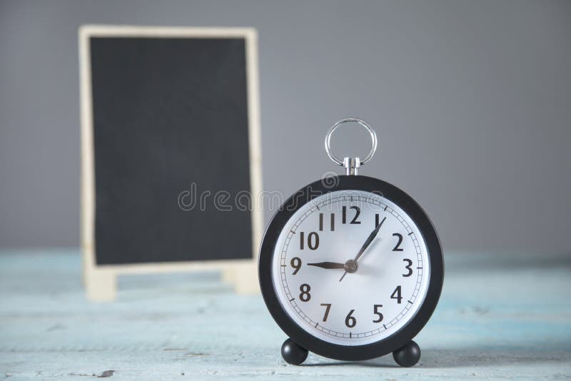 Chalkboard with Clock on the Table Stock Image - Image of chalkboard ...