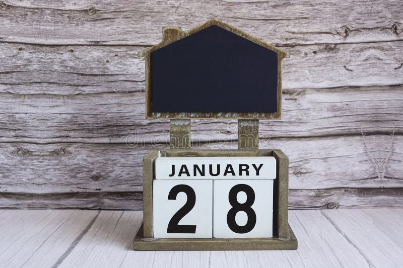 Chalkboard with January 28 Date on White Cube Block on Wooden Table ...