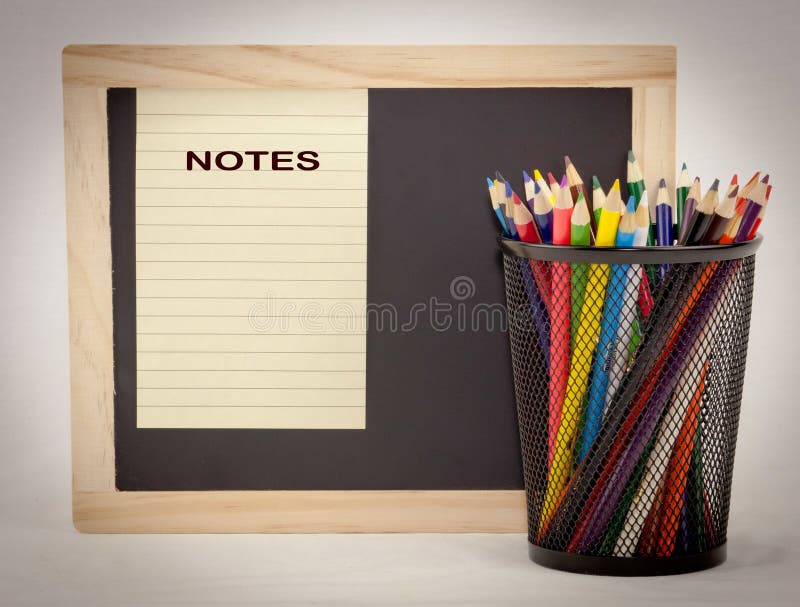 Chalkboard with Notepad Paper and Colored Pencils Stock Image - Image ...