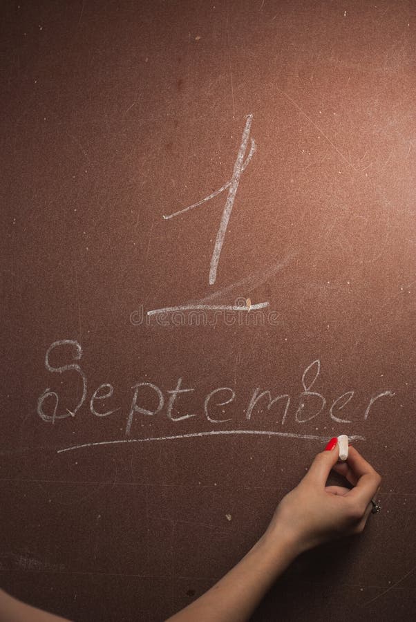 Chalkboard with September 1 Written in White Chalk, Hand Writing on a ...