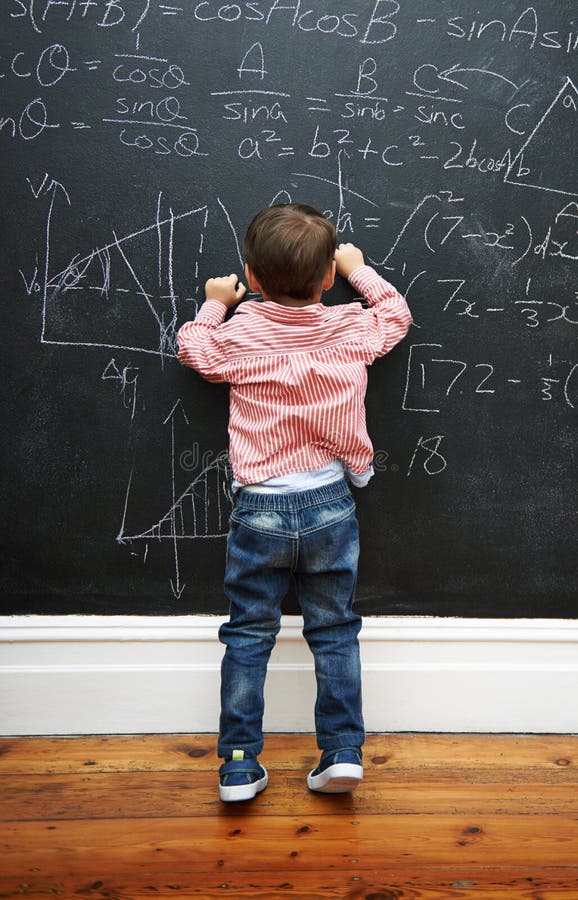 Challenge Accepted. a Young Boy with a Blackboard Full of Math ...