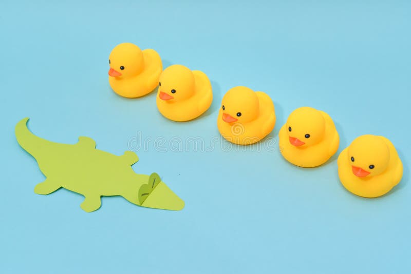 Challenge Concept, Rubber Ducks are Facing Crocodile. Stock Image ...