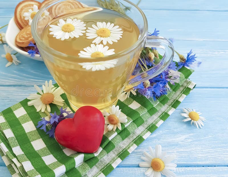 Chamomile Tea, Cornflower Biscuit, Heart on a Wooden Background Stock ...