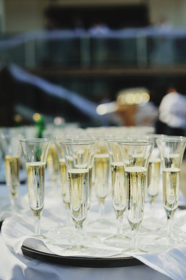 Waiters welcome visitors stock image. Image of champagne - 6093559