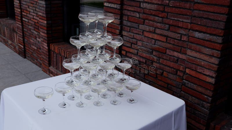 Champagne Glasses Stacked in Elegant Pyramid Formation, White ...