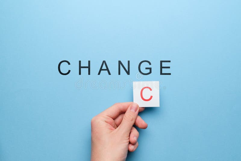 Chance and Change Concept. Hand with a White Sticker on a Blue ...