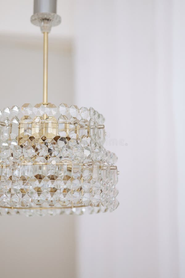 A Chandelier with a Gold Base and a Clear Glass Top Stock Image - Image ...
