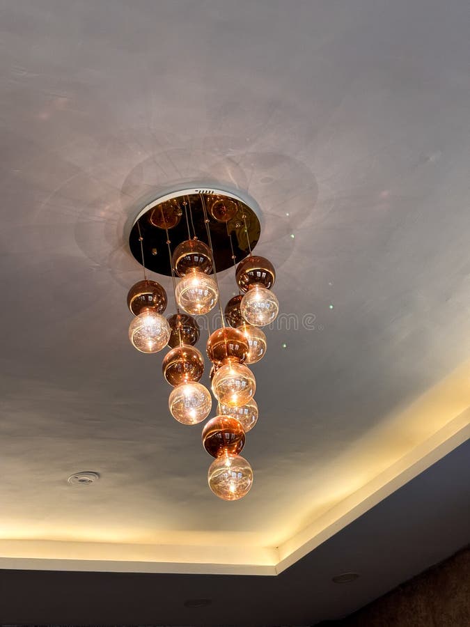 A Chandelier with Many Lights Hanging from it Stock Image - Image of ...