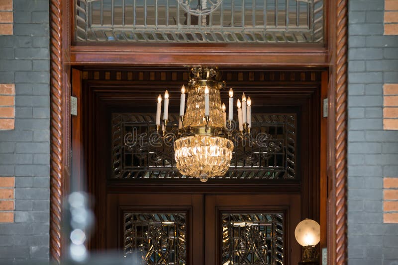 Chandelier Visible through Building Entrance Stock Photo - Image of ...