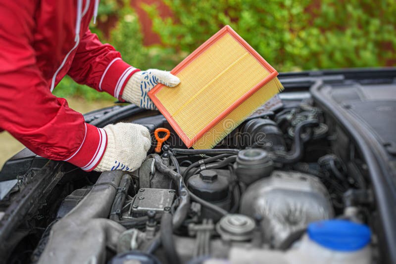 Change the Filter on the Car Engine during Vehicle Maintenance. Stock ...