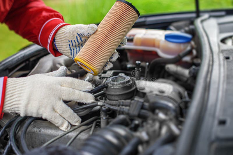 Change the Filter on the Car Engine during Vehicle Maintenance. Stock ...