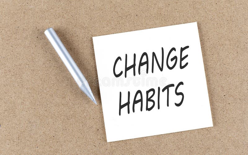 CHANGE HABITS Text on Sticky Note on a Cork Board with Pencil Stock ...