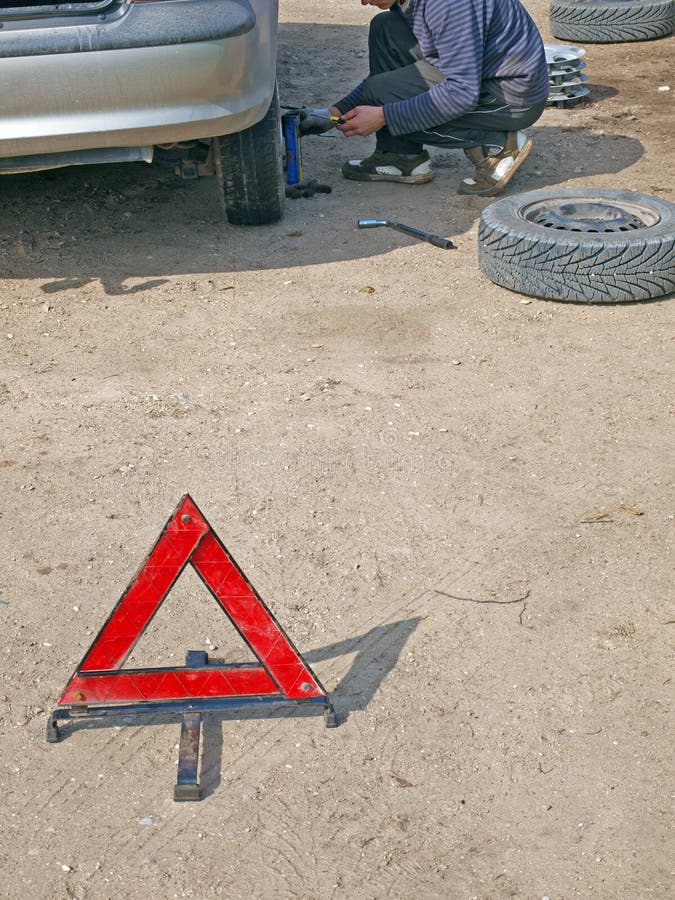 Change tire 2 stock image. Image of triangle, road, sign - 19229077