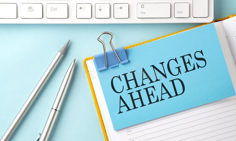 CHANGES AHEAD Text on Sticker on the Blue Background with Pen and ...