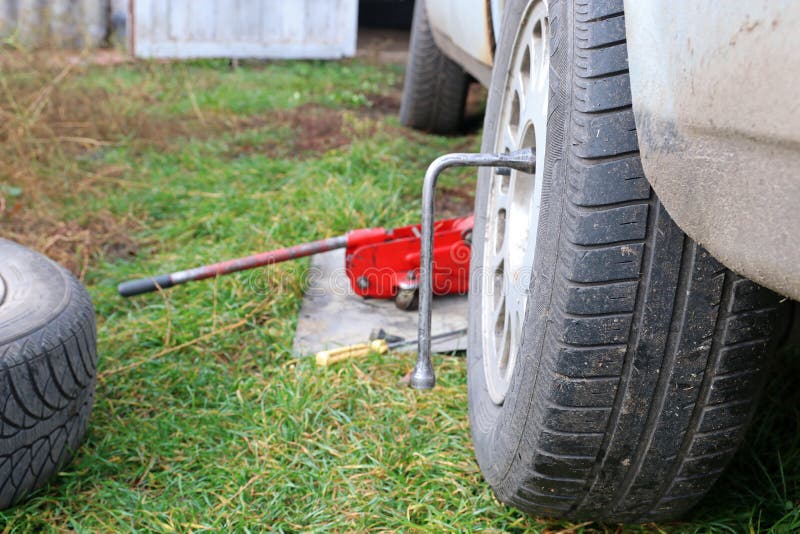Changing Car Wheels. Replacement of Winter and Summer Tires. Stock ...