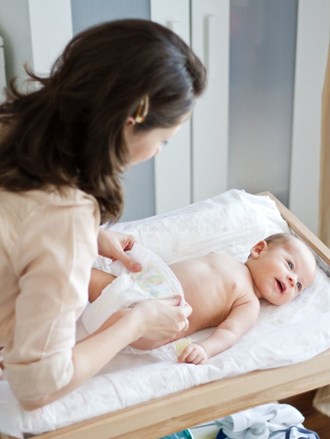 Changing diaper stock photo. Image of woman, home, caring - 33489758