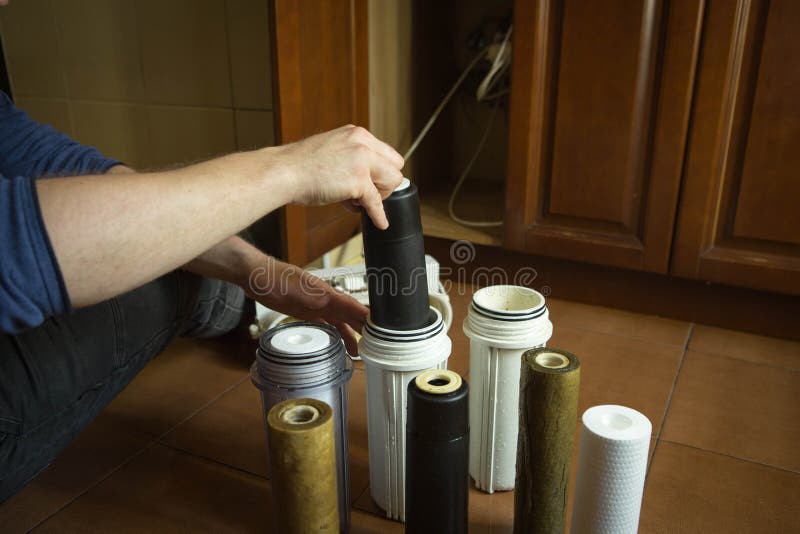 Changing Filters in Your Home Water Purification System. the Master ...