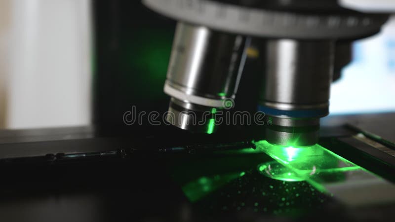 Changing Lenses of a Fluorescence Microscope. Modern Microscope Stock ...