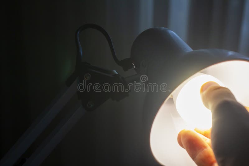 Changing of a Light Bulb. Removing Bulb from the Socket Stock Image ...