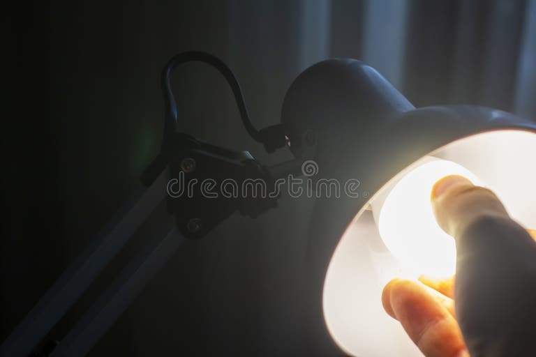 Changing of a Light Bulb. Removing Bulb from the Socket Stock Image ...
