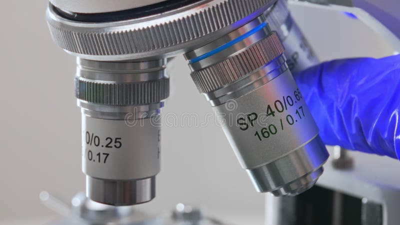 Changing the Magnification of Microscope. Stock Video - Video of ...