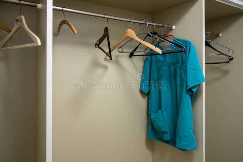 In a Changing Room in an Operating Room Hangs Green Surgical Clothing ...
