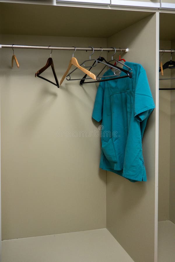 In a Changing Room in an Operating Room Hangs Green Surgical Clothing ...