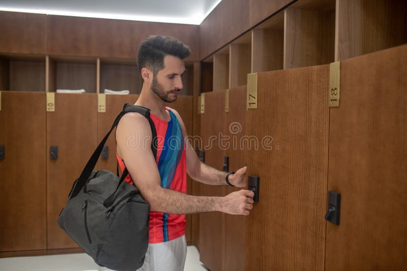 Young Man in Bright Tshirt Closing the Locker Stock Image - Image of ...