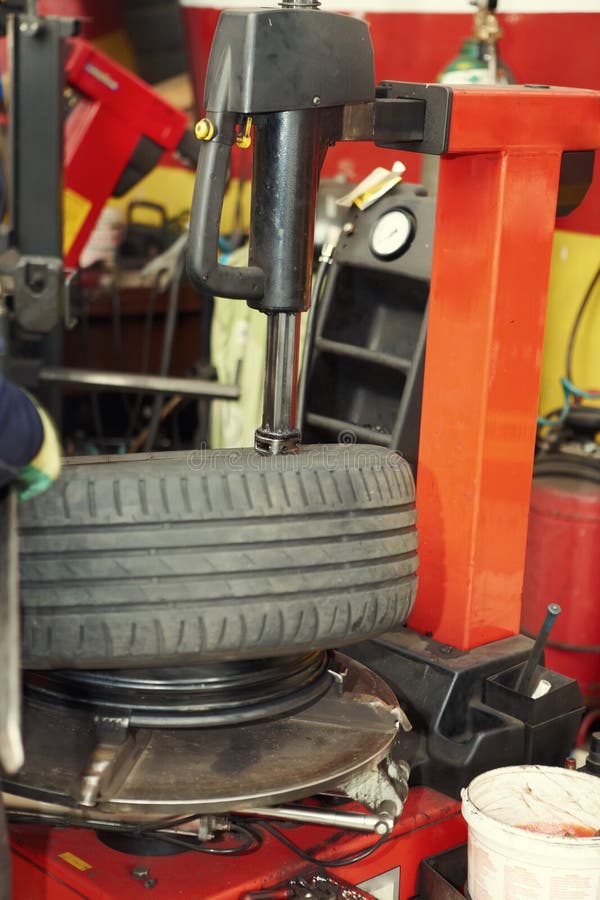 Changing a Tire in a Garage Stock Photo - Image of tyre, mechanical ...