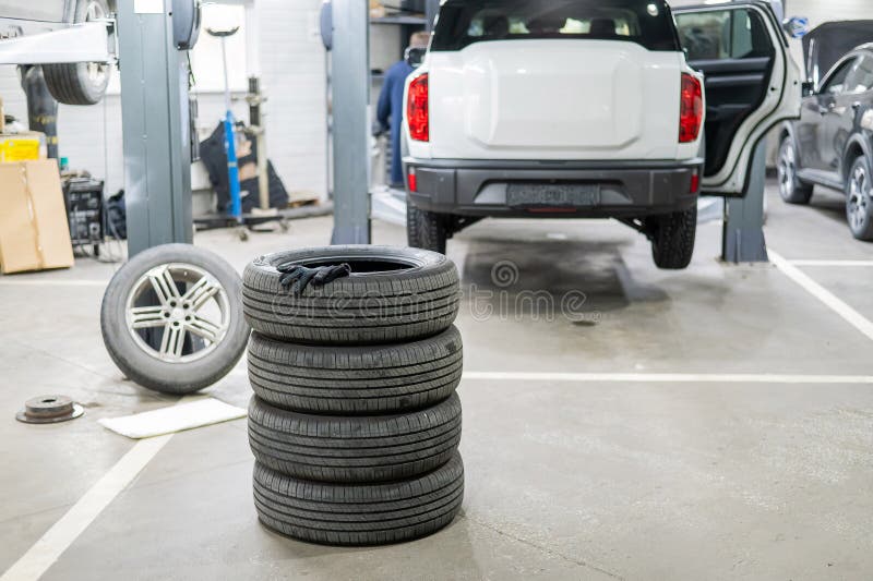 Changing Tires for a Car According To the Season. Stock Photo - Image ...