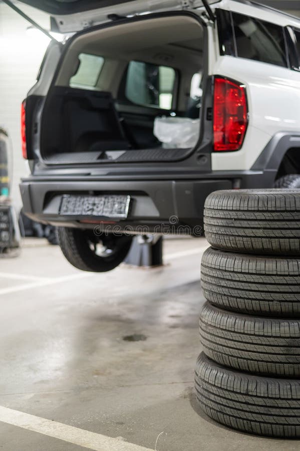 Changing Tires for a Car According To the Season. Stock Photo - Image ...