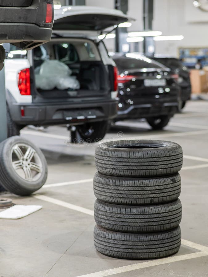 Changing Tires for a Car According To the Season. Stock Image - Image ...