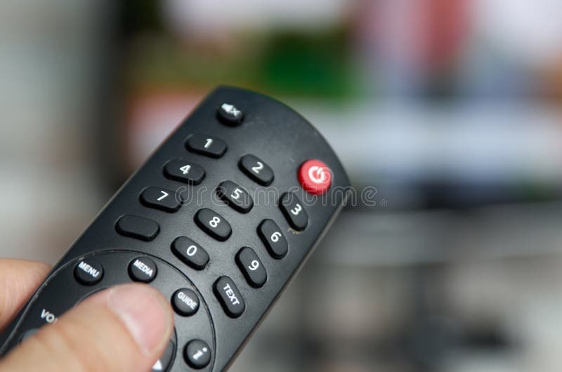 Changing TV Program: Close Up of Human Hand Holding Television Remote ...