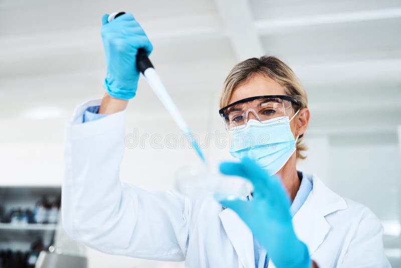 Changing Variables while Conducting Tests. a Scientist Using a Dropper ...