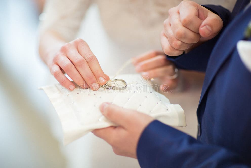 Changing of wedding rings stock photo. Image of blue - 91800452