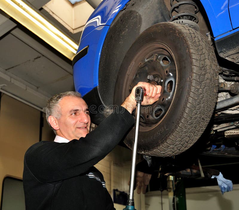 Changing a wheel. stock photo. Image of auto, technician - 21730878