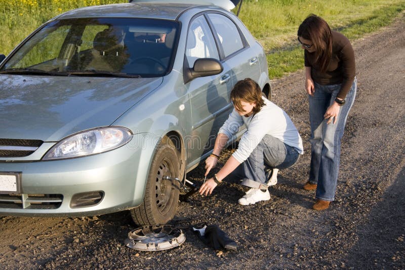 Changing the wheel stock image. Image of puncture, asphalt - 6468411
