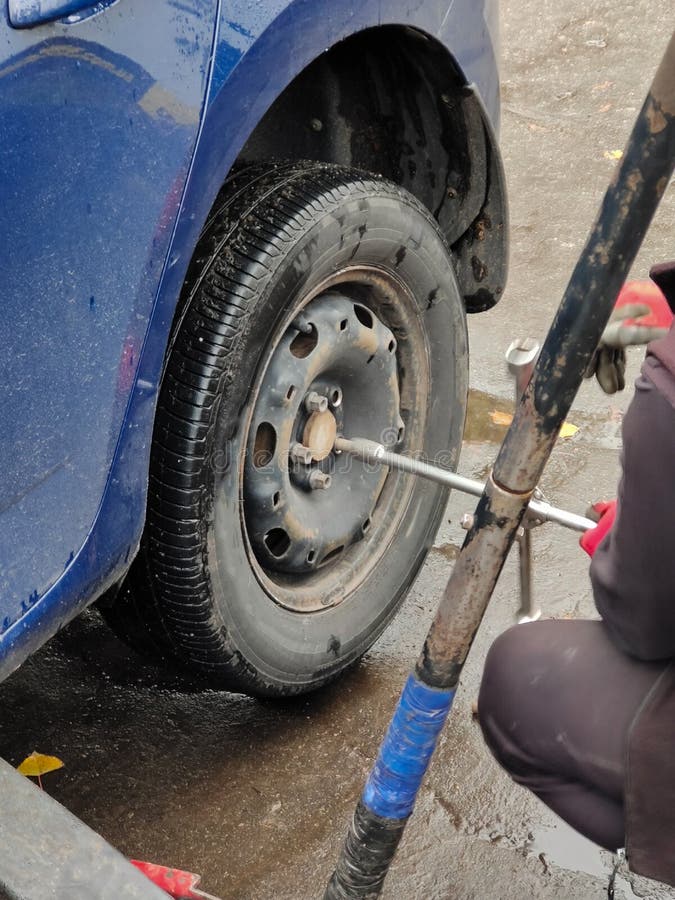 Changing a Wheel on a Car Jack at a Car Service Station Stock Image ...