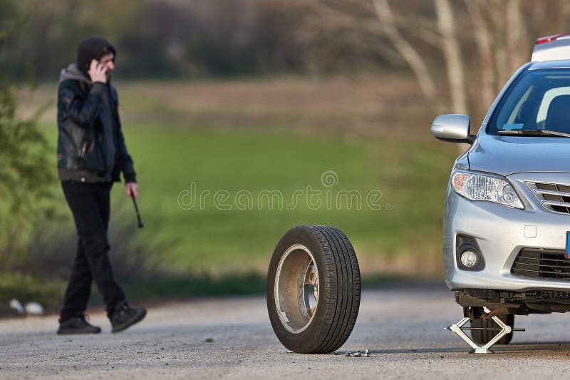 Tire Change Problems on the Road, Phona Call for Help Stock Image ...
