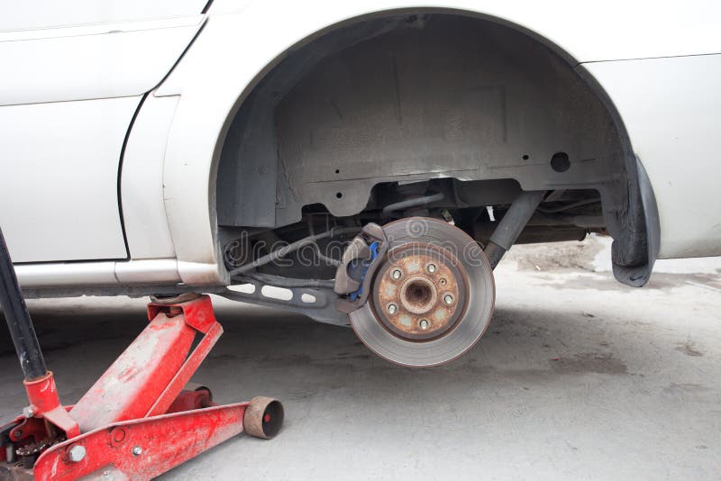 Changing a Wheel of a Modern Car Stock Photo - Image of garage, tire ...